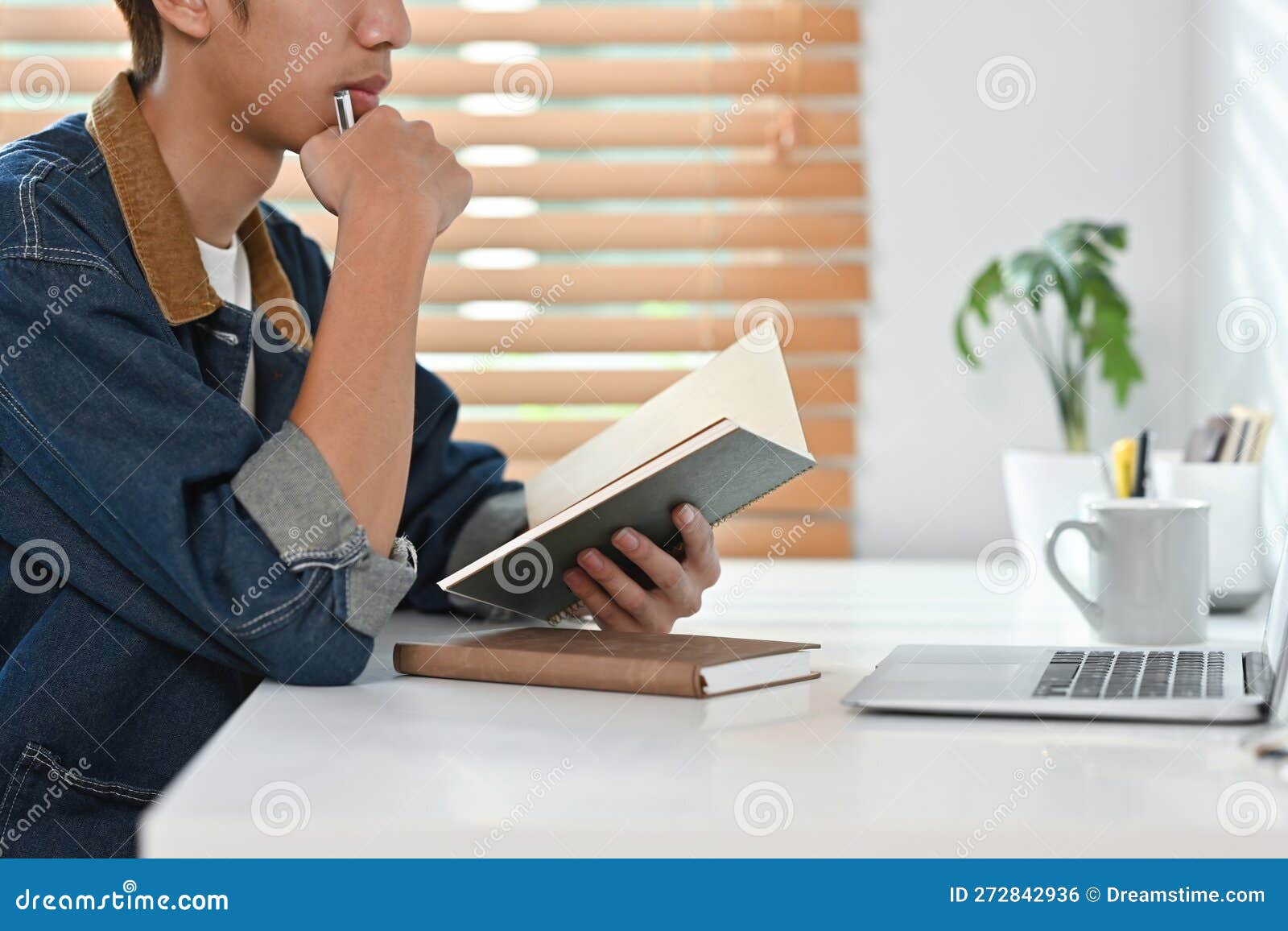 Stylish Man Holding Notebook and Working on Laptop at Home. Freelance ...
