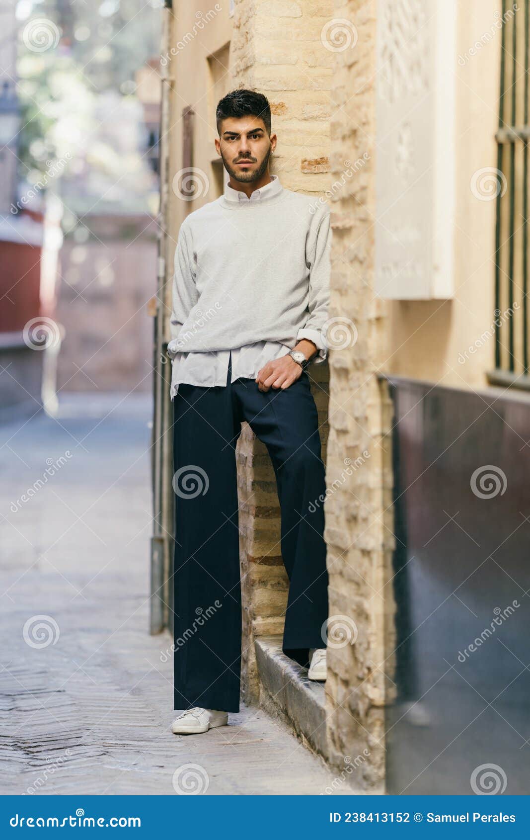 Stylish Man Posing while Looking at the Camera with a Cocky Expression ...