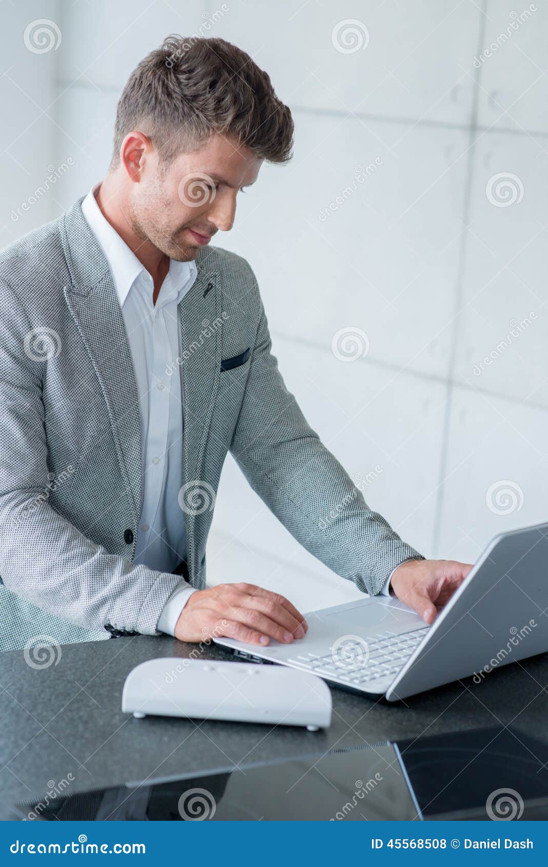 Stylish Man Sitting Typing on a Laptop Stock Photo - Image of caucasian ...