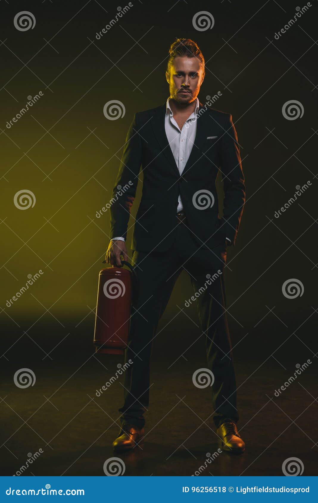 Stylish Man in Tuxedo Standing and Holding Fire Extinguisher Stock ...