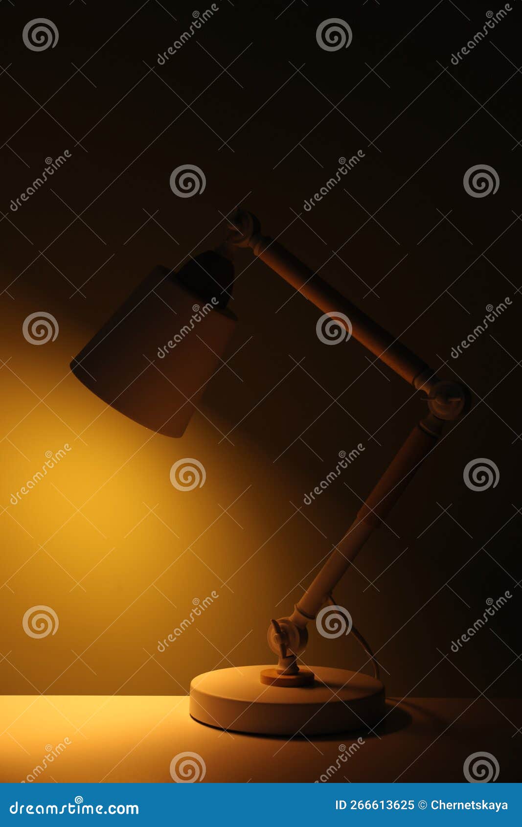 Stylish Modern Desk Lamp on Table at Night Stock Image - Image of ...