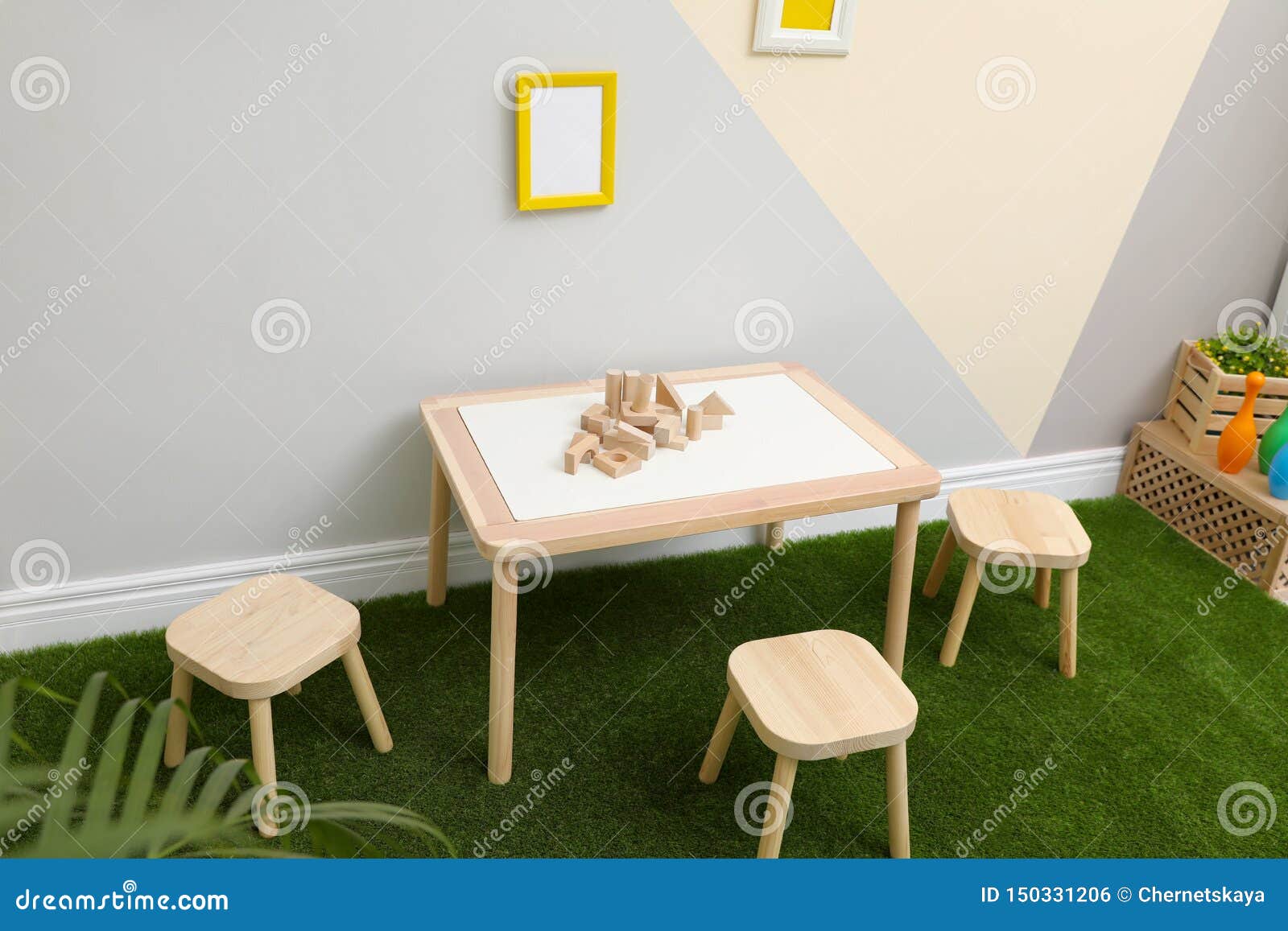Playroom Interior with Table, Stools and Green Carpet Stock Photo ...