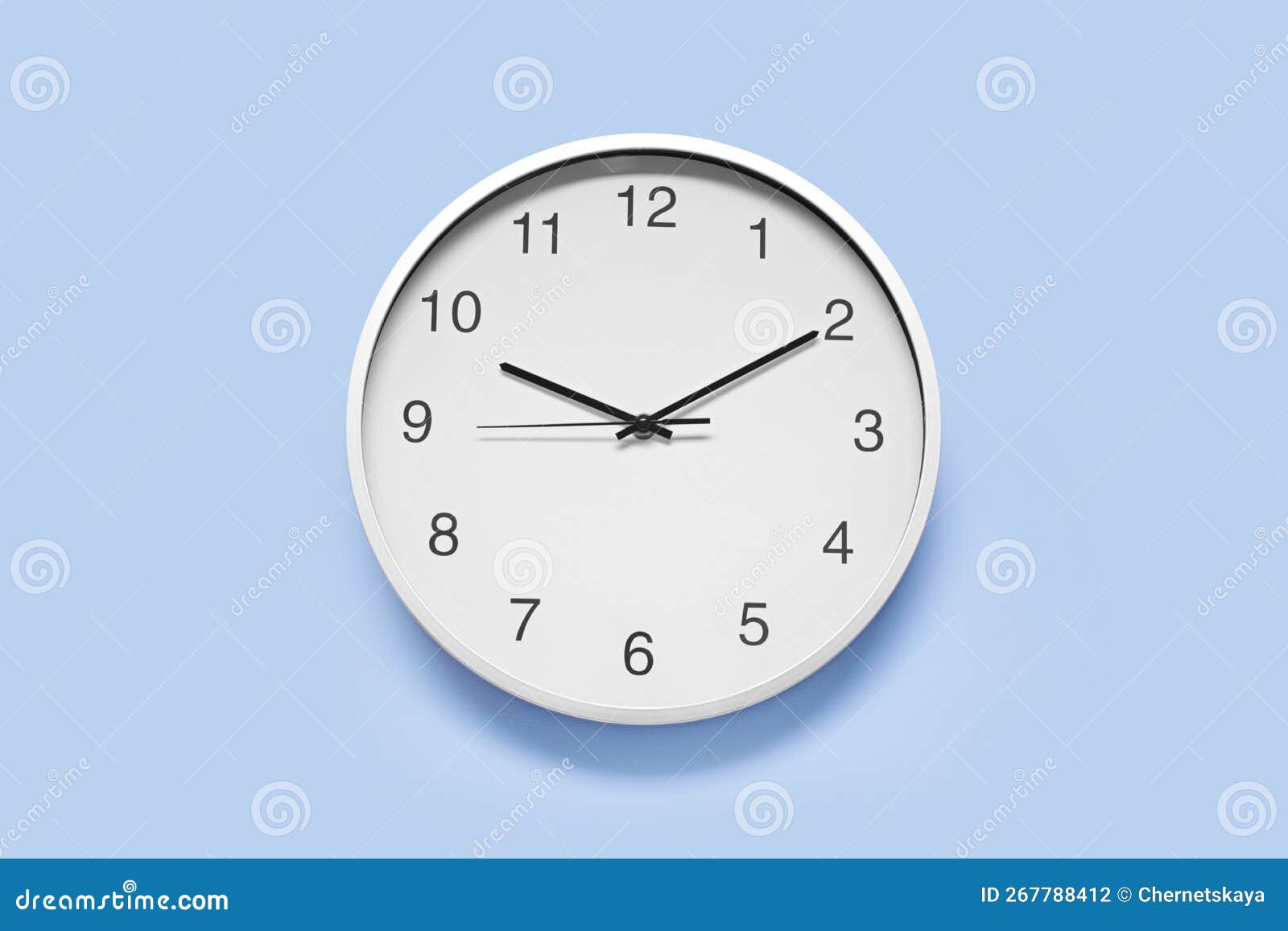 Stylish Round Clock on Light Blue Background, Top View. Interior ...