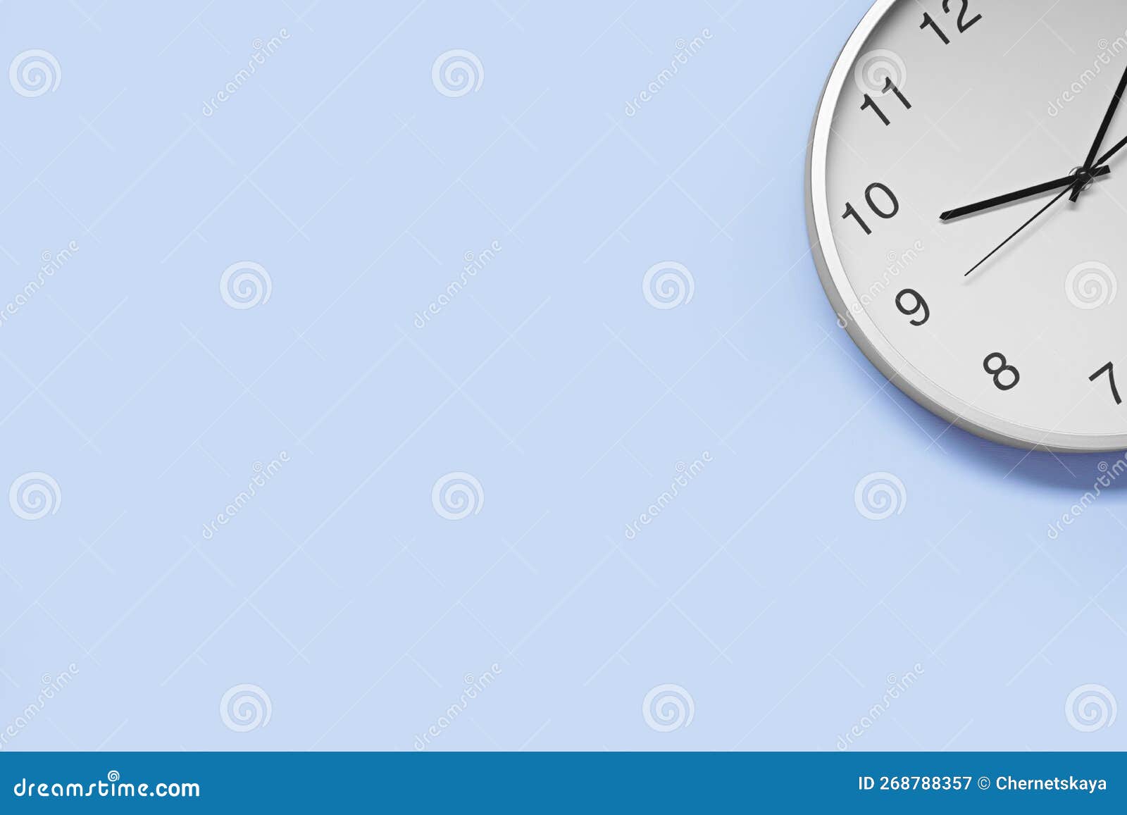 Stylish Round Clock on Light Blue Background, Top View with Space for ...