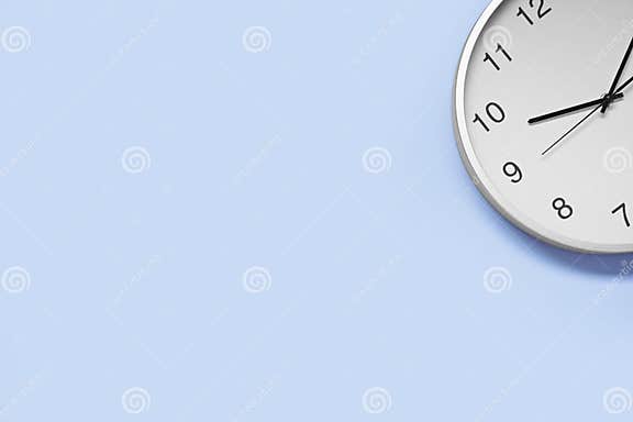 Stylish Round Clock on Light Blue Background, Top View with Space for ...