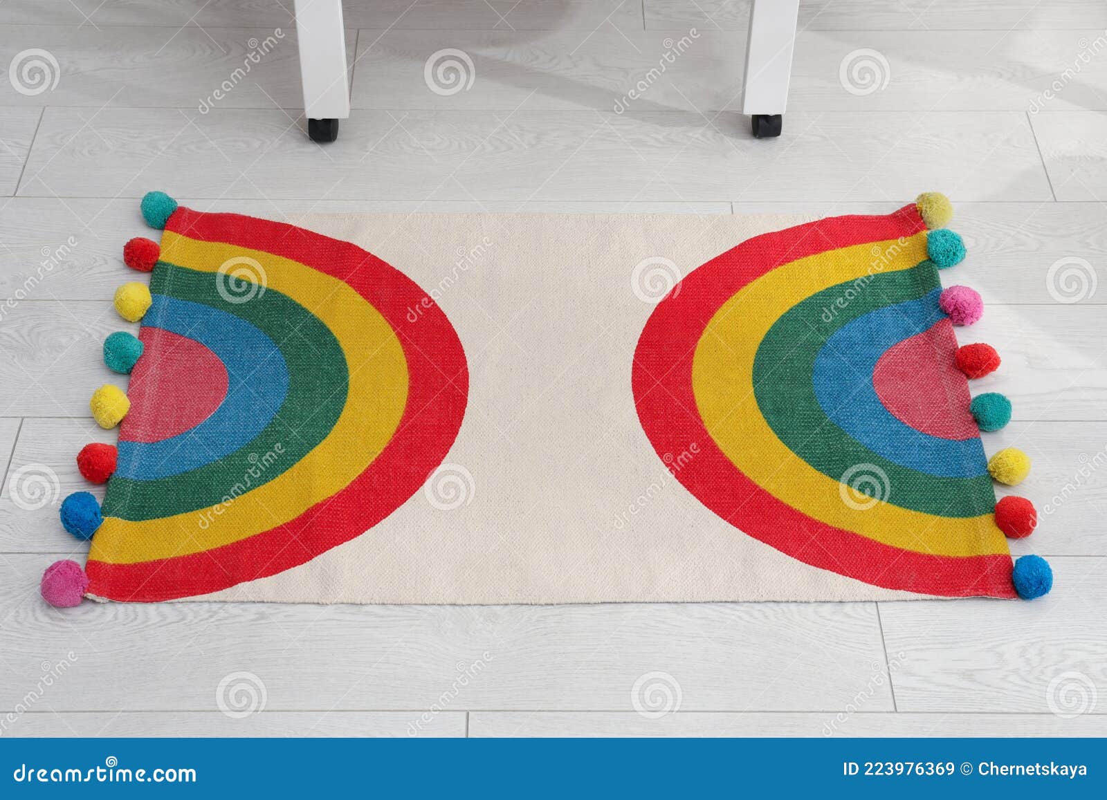 Stylish Rug with Rainbow on Floor Stock Image - Image of rainbow ...