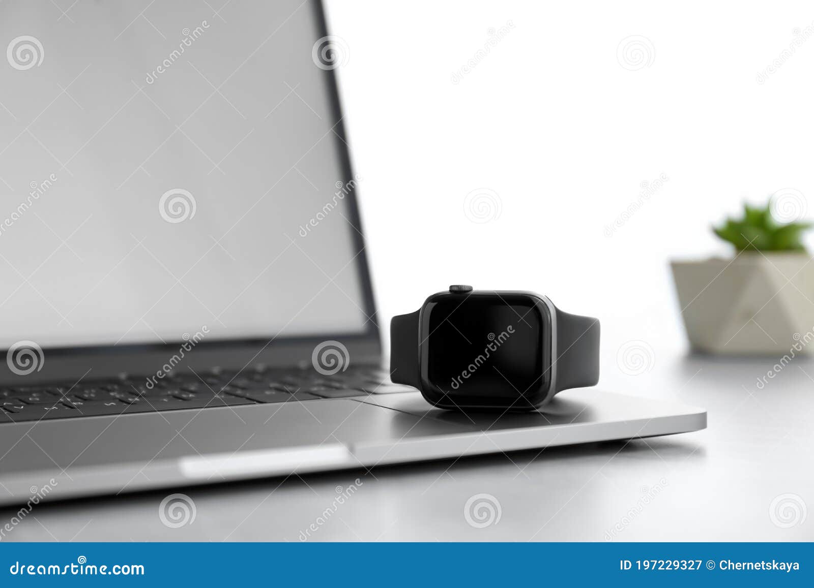 Stylish Smart Watch and Laptop on Grey Table Stock Image - Image of ...