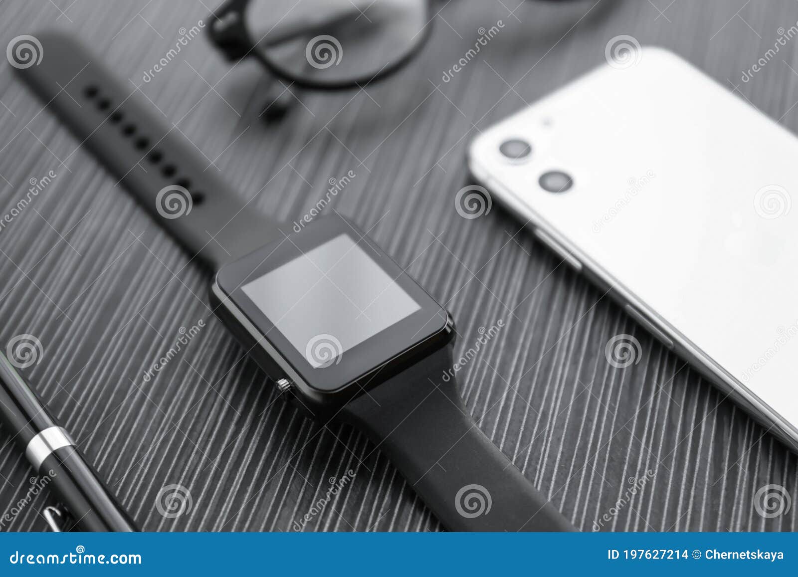 Stylish Smart Watch, Phone and Pen on Table, Closeup Stock Photo ...