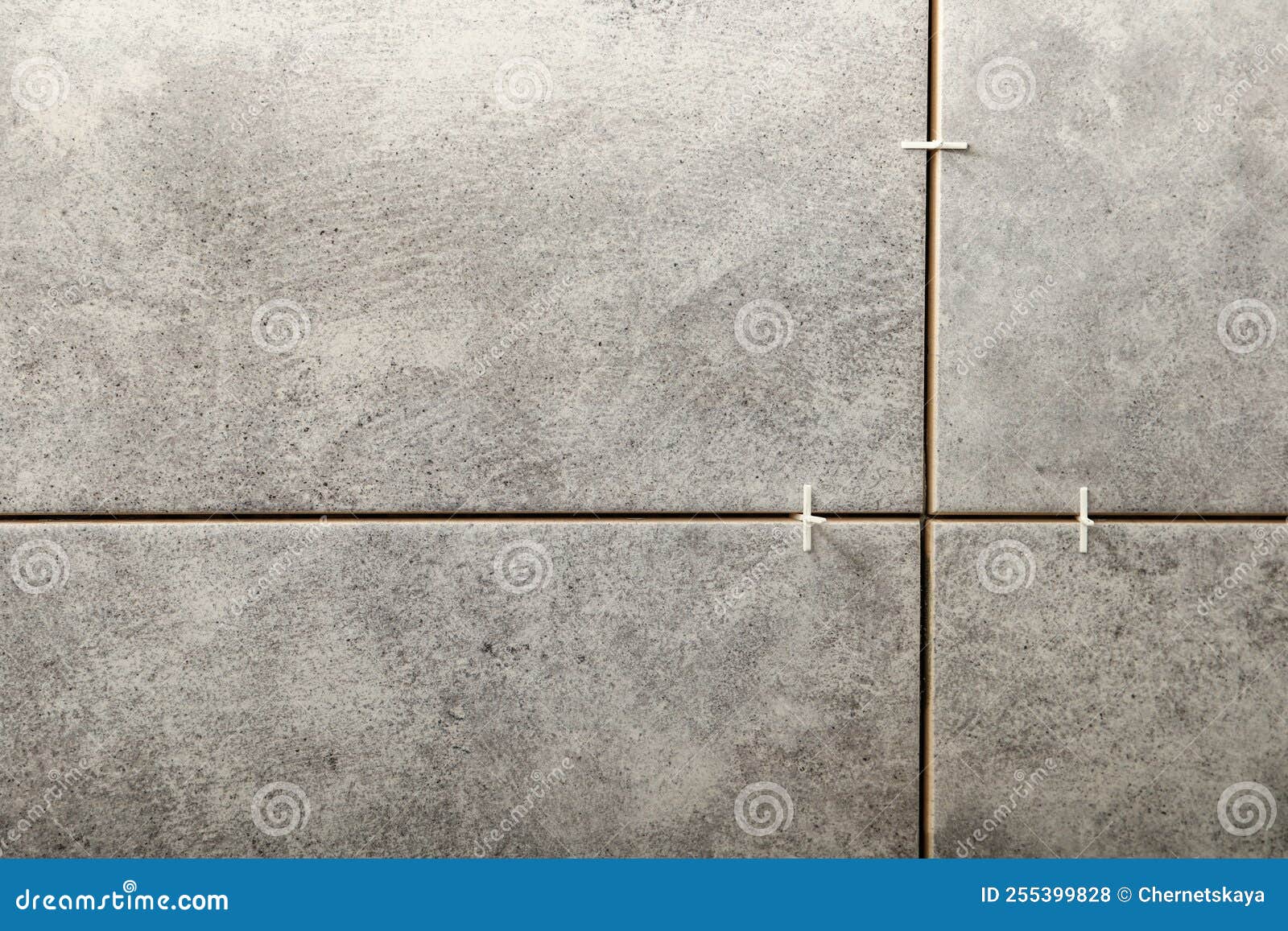 Stylish Tiles with Spacers on Wall in Room Stock Photo - Image of ...