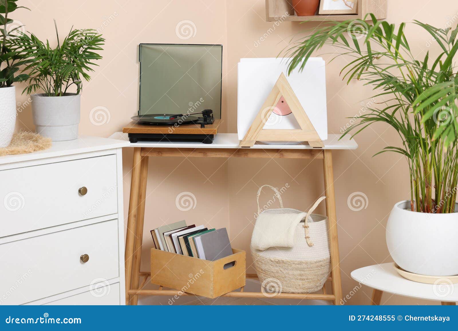 Stylish Turntable with Vinyl Record on Console Table in Cozy Room Stock ...