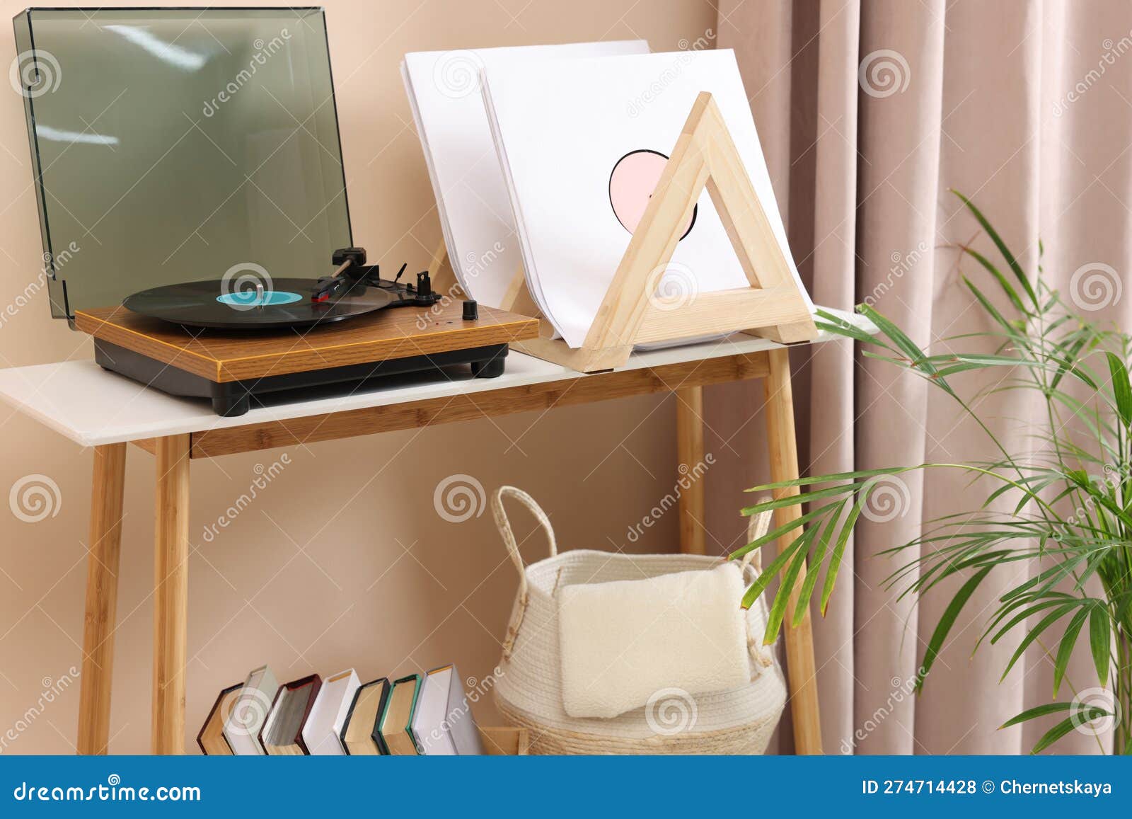 Stylish Turntable with Vinyl Record on Console Table in Cozy Room Stock ...