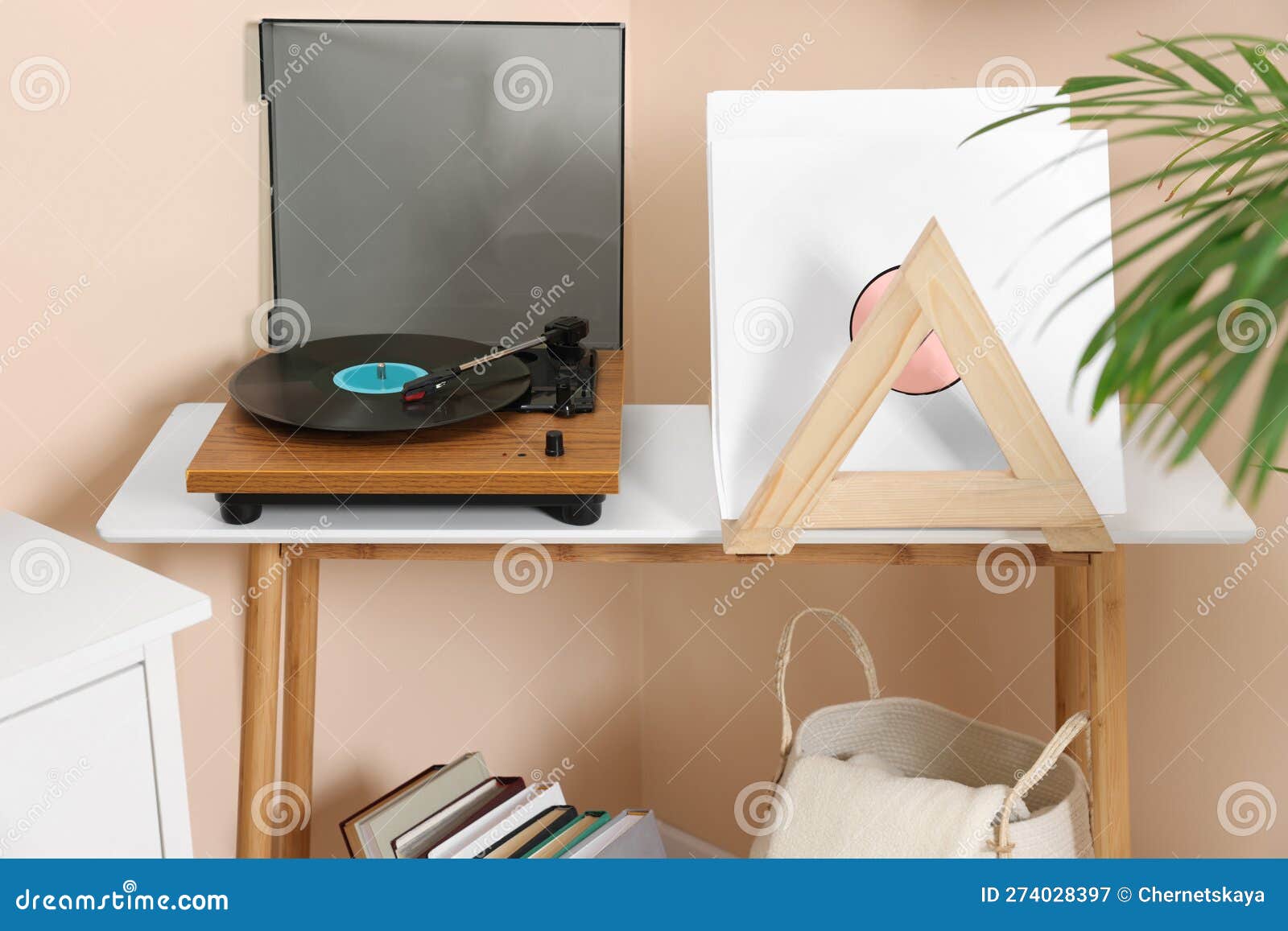 Stylish Turntable with Vinyl Record on Console Table in Room Stock ...