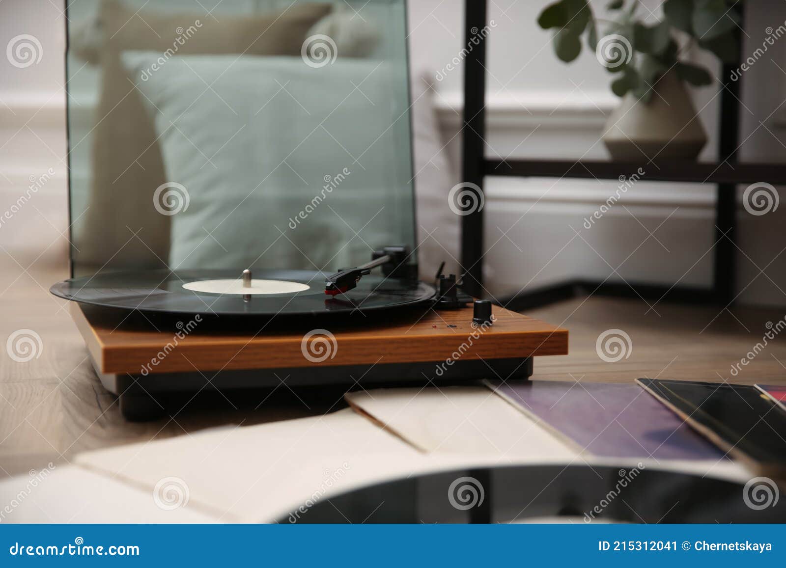 Stylish Turntable with Vinyl Records on Floor Indoors Stock Image ...