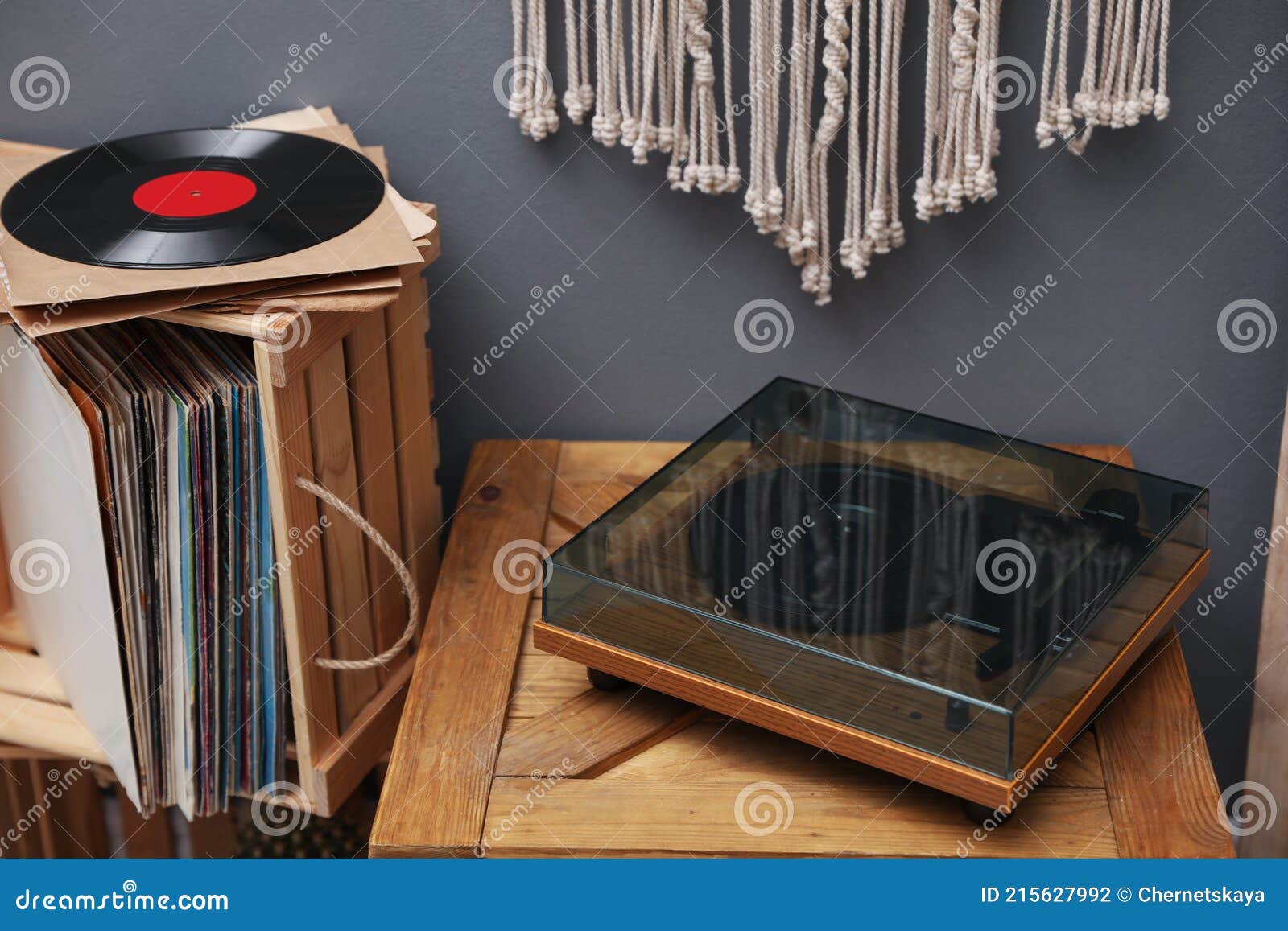 Stylish Turntable on Wooden Crate in Room Stock Photo - Image of design ...