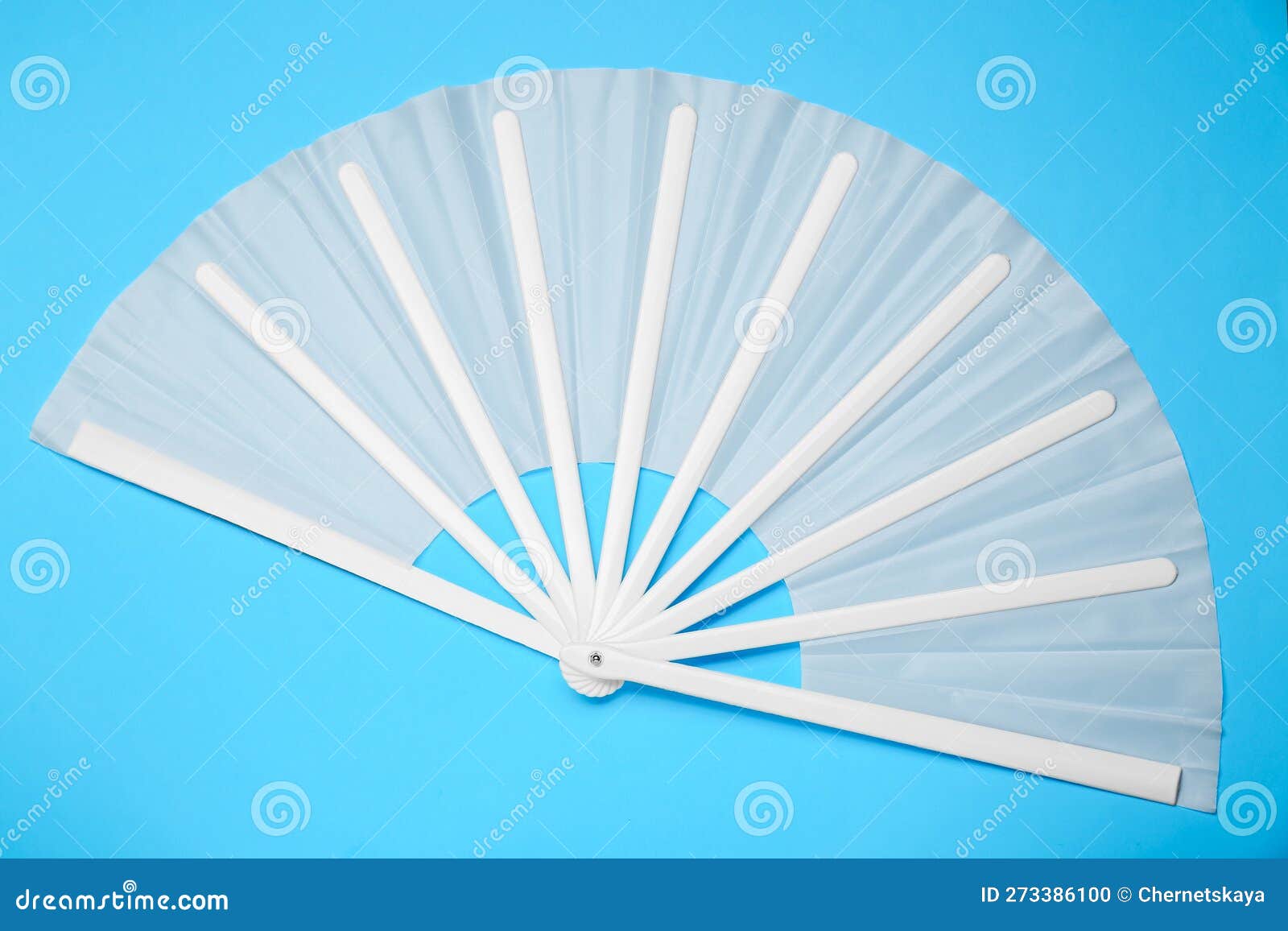 Stylish White Hand Fan on Light Blue Background, Top View Stock Photo ...