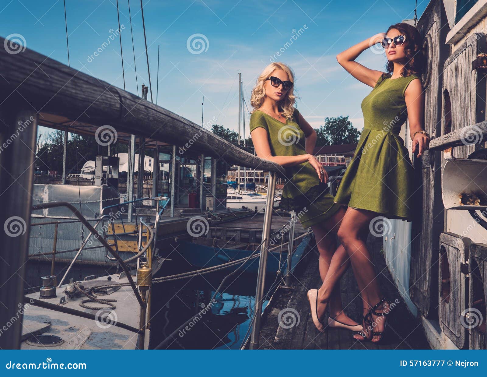 Stylish women on old boat stock image. Image of longboat - 57163777