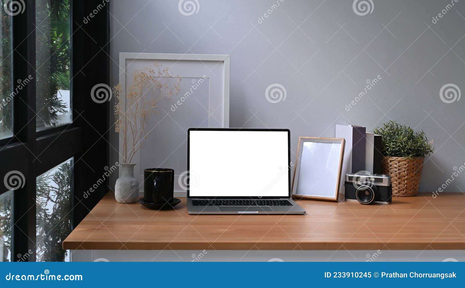 Workplace with Laptop Computer, Picture Frame and Houseplant. Stock ...