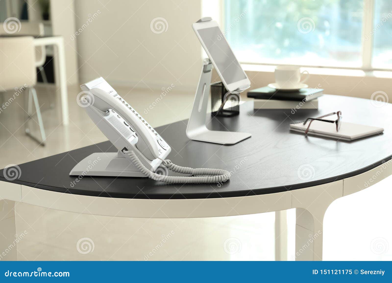 Stylish Workplace with Telephone and Tablet PC on Table in Office Stock ...