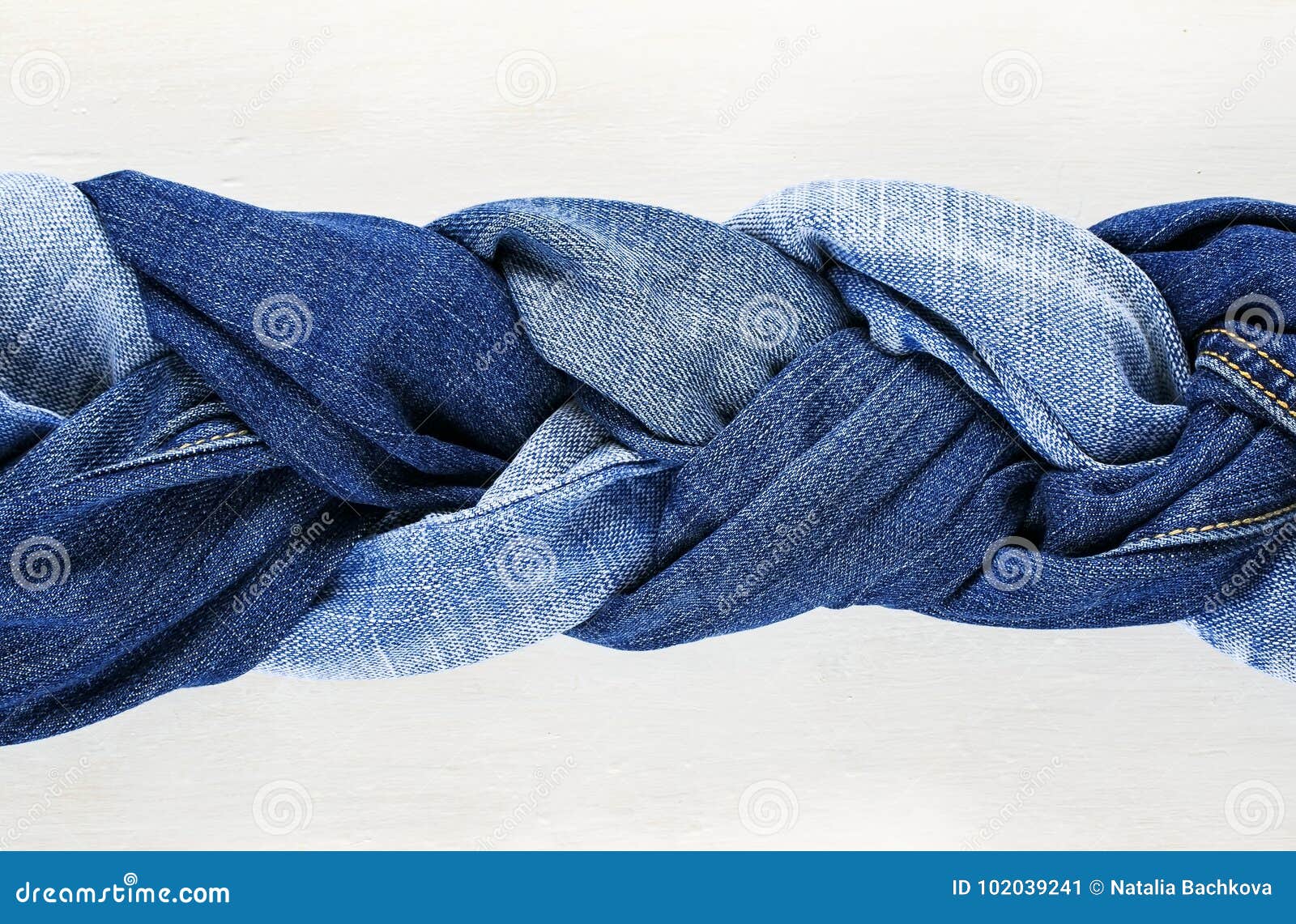 Stylish Woven Braid of Blue Jeans on a White Wooden Background Stock ...