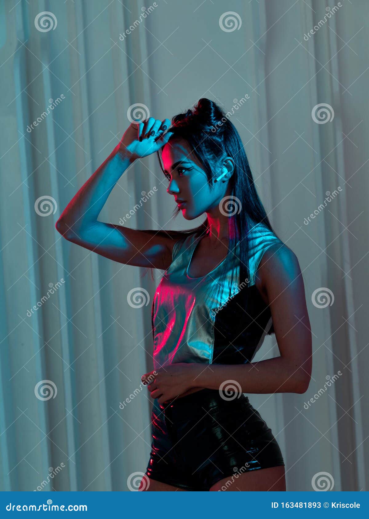 Stylish Young Girl in Silver Top. Portrait in Futuristic Cyberpunk ... Stylish Young Girl in Silver Top. Portrait in Futuristic Cyberpunk ...