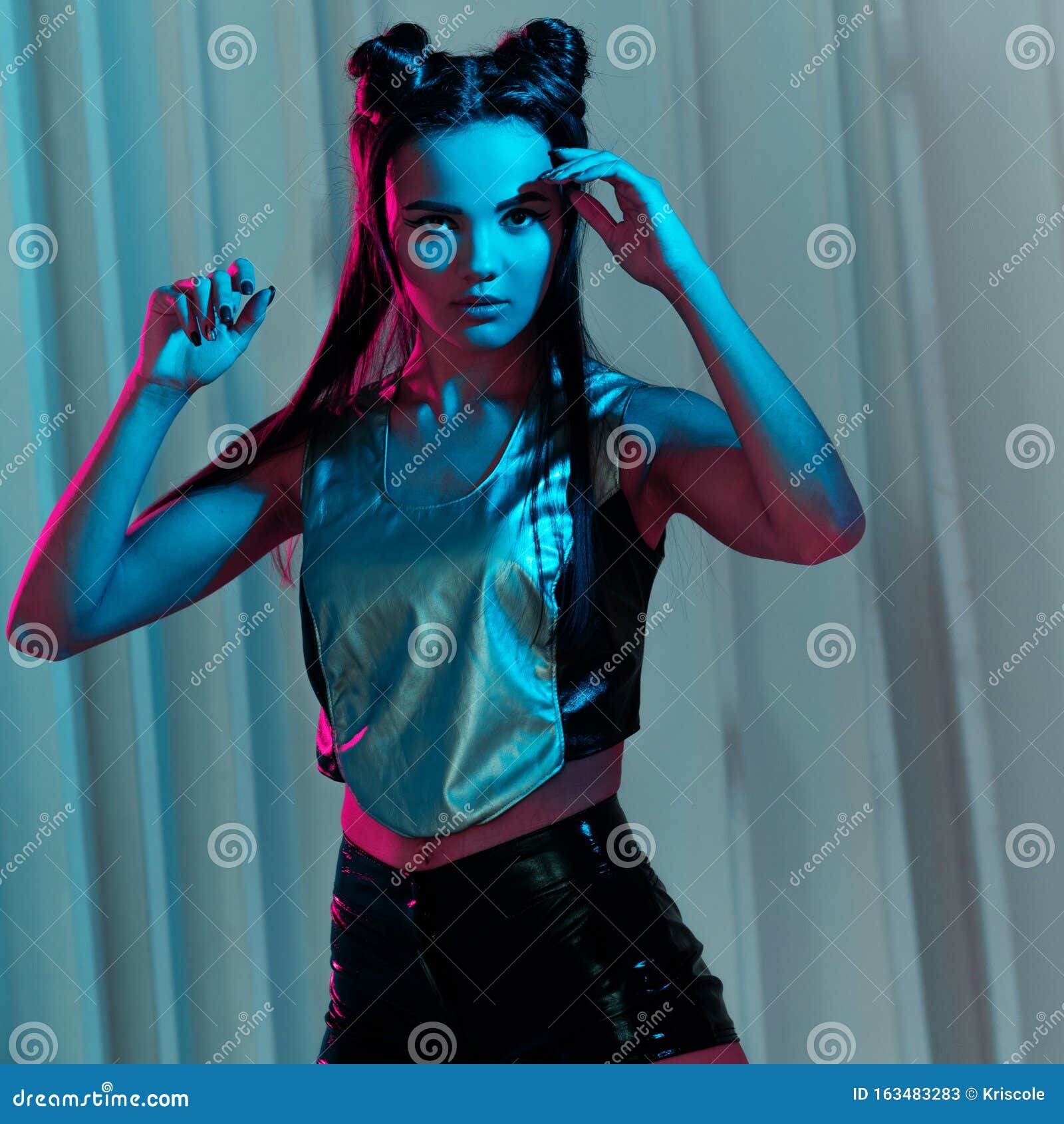 Stylish Young Girl in Silver Top. Portrait in Futuristic Cyberpunk ... Stylish Young Girl in Silver Top. Portrait in Futuristic Cyberpunk ...