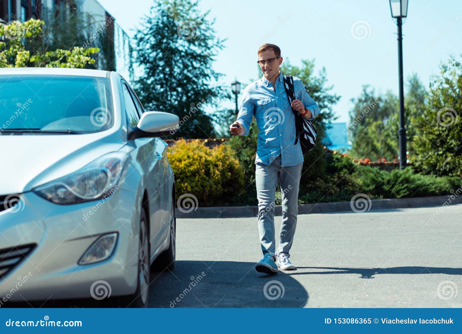 Stylish Young Man with Backpack Opening Car in the Morning Stock Image ...
