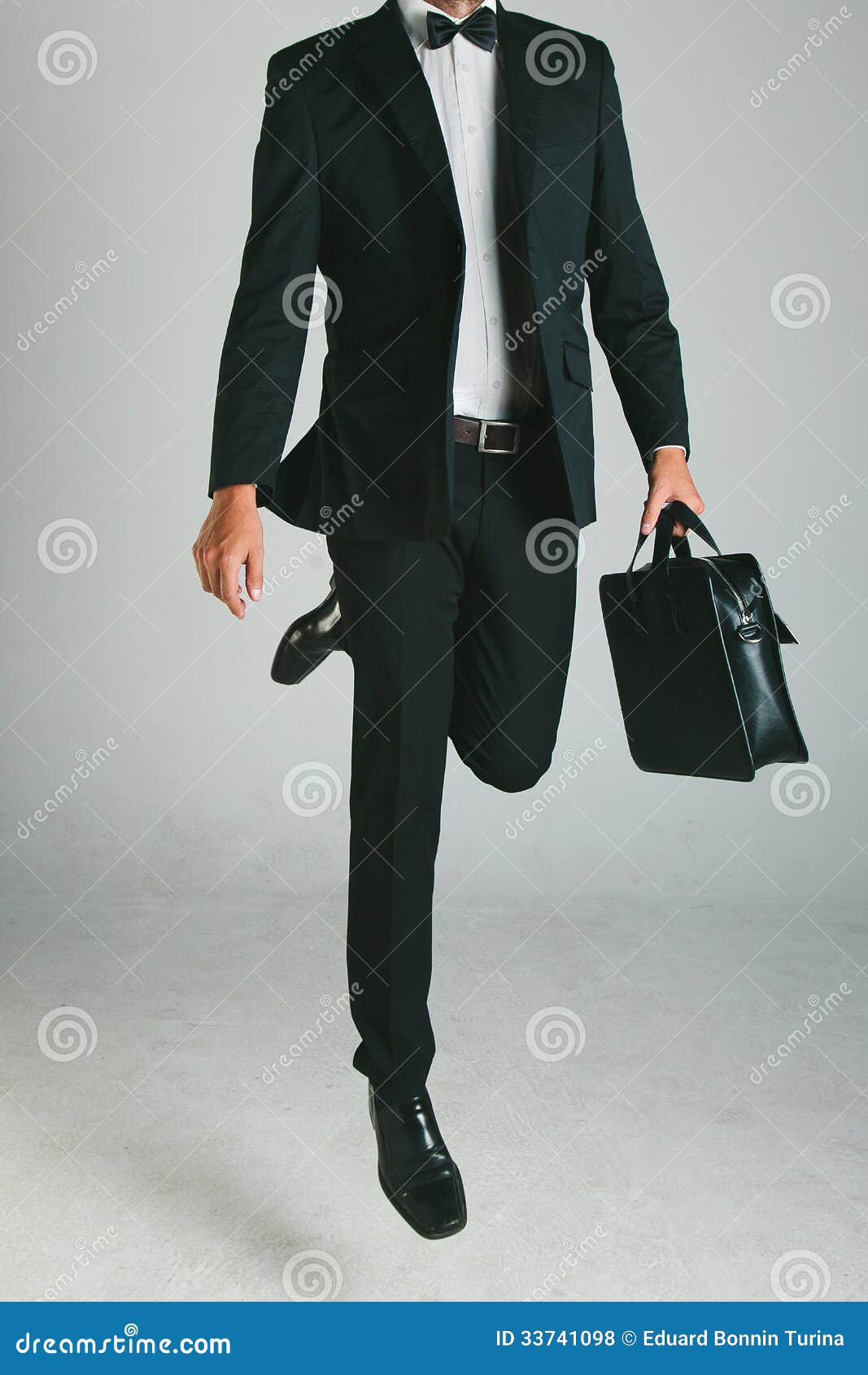 Stylish Young Man with Black Suit and Briefcase. Stock Photo - Image of ...