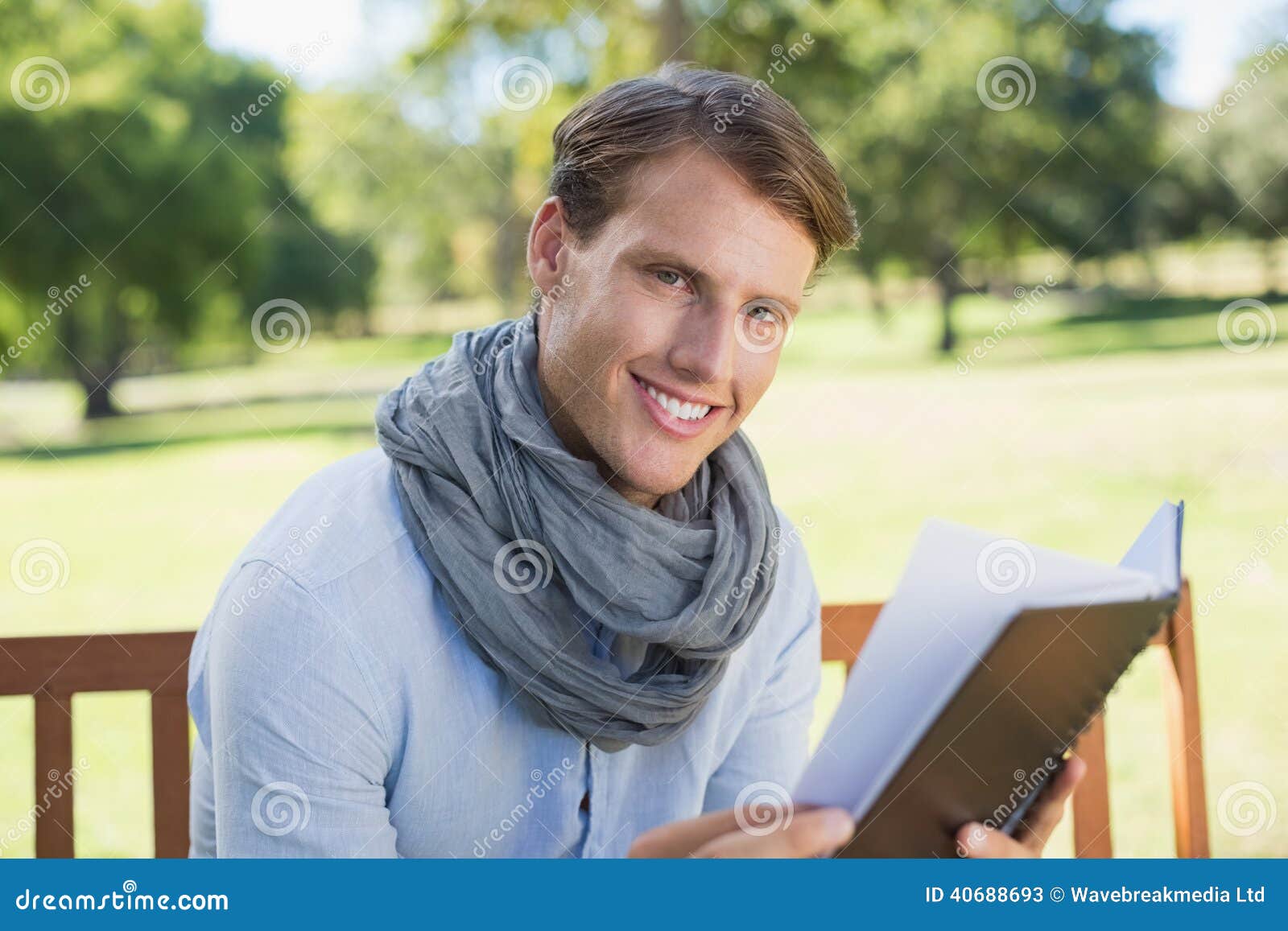 Stylish Young Man Holding Journal Smiling at Camera Stock Image - Image ...