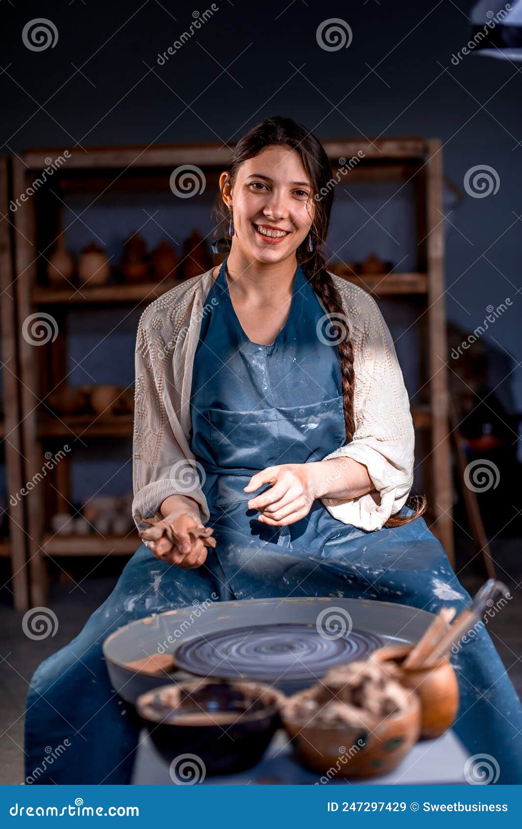 Charming Craftsman Master Posing while Making Earthenware. she is ...