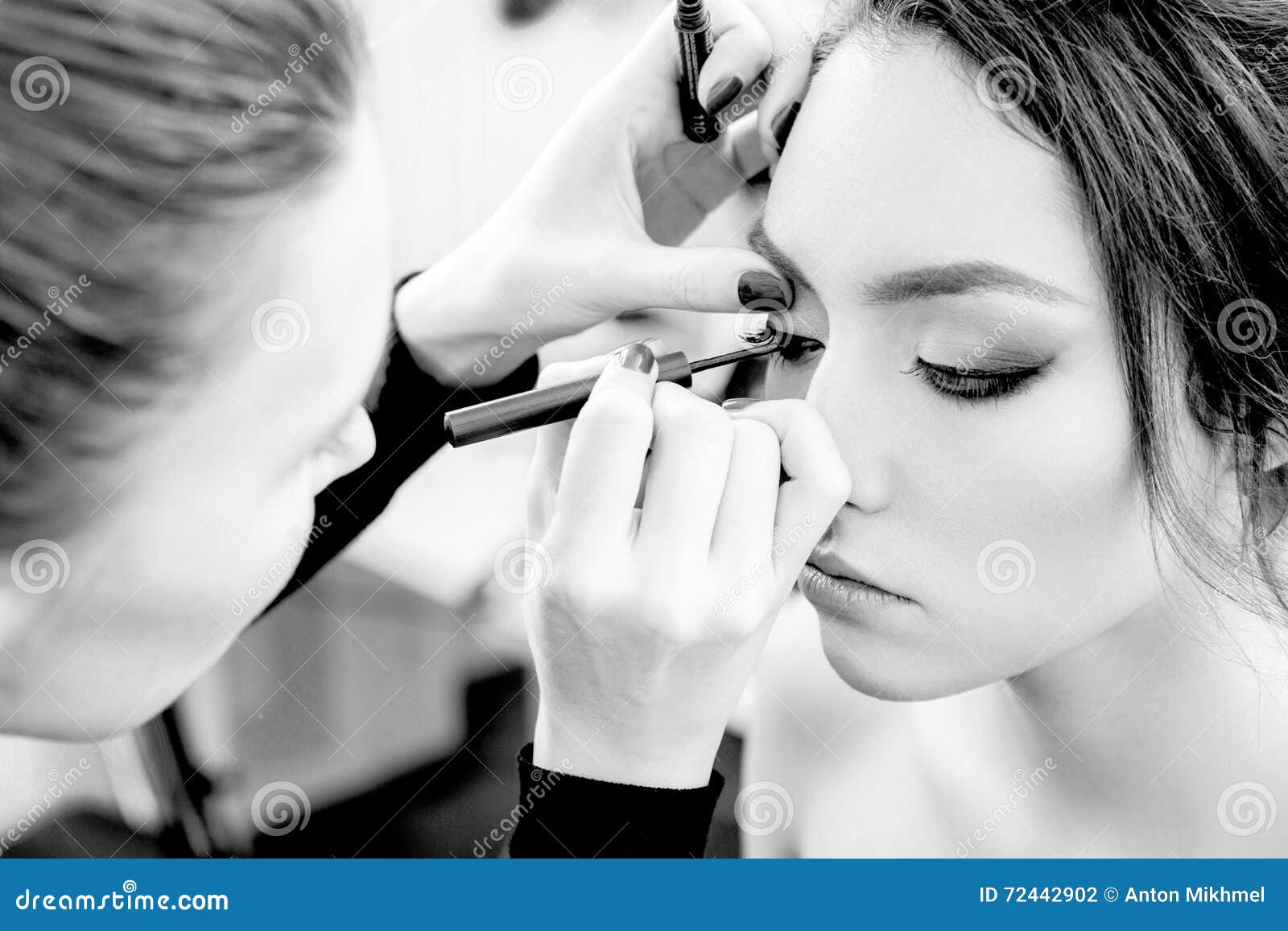 Stylist Makes Professional Eye Makeup. Stock Photo - Image of holding ...