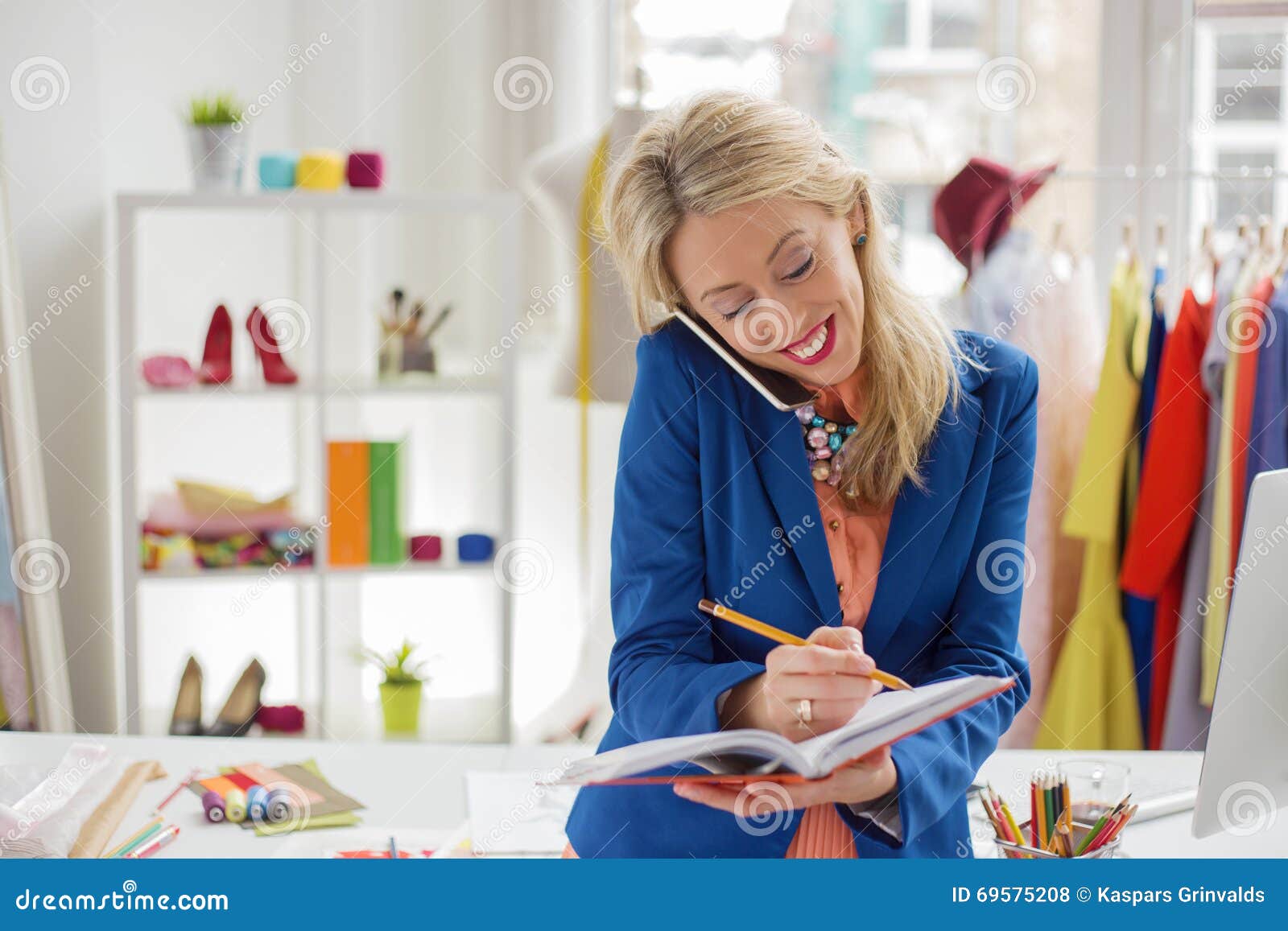 Stylist Talking on the Smartphone and Making an Appointment Stock Photo ...