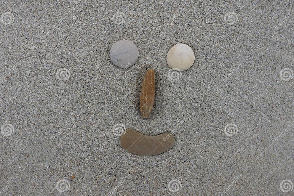 Stylized Face Composed with Pebbles on the Beach Stock Image - Image of ...