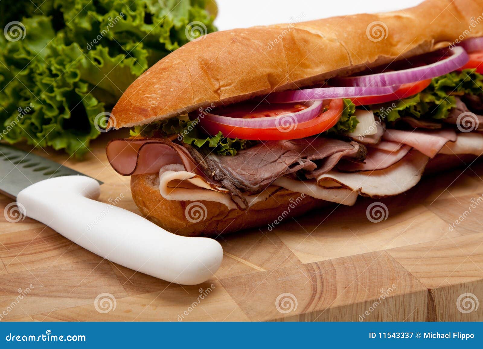 A Sub Sandwich on a Wooden Cutting Board Stock Image - Image of fast ...