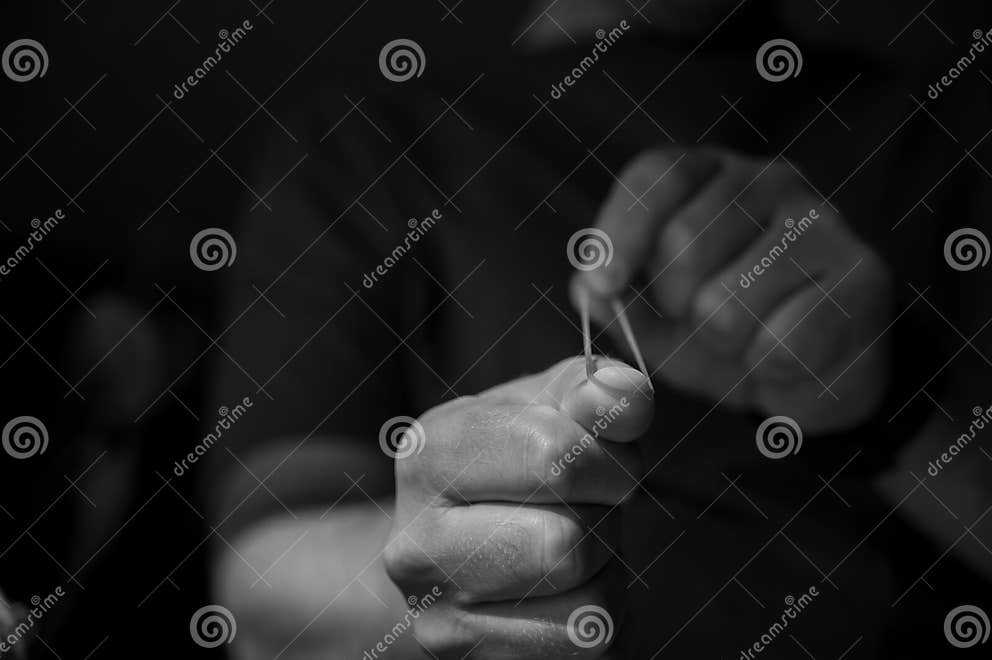 Subjective Focus on Rubber Band Pulled Taunt Being Aimed at the Camera ...