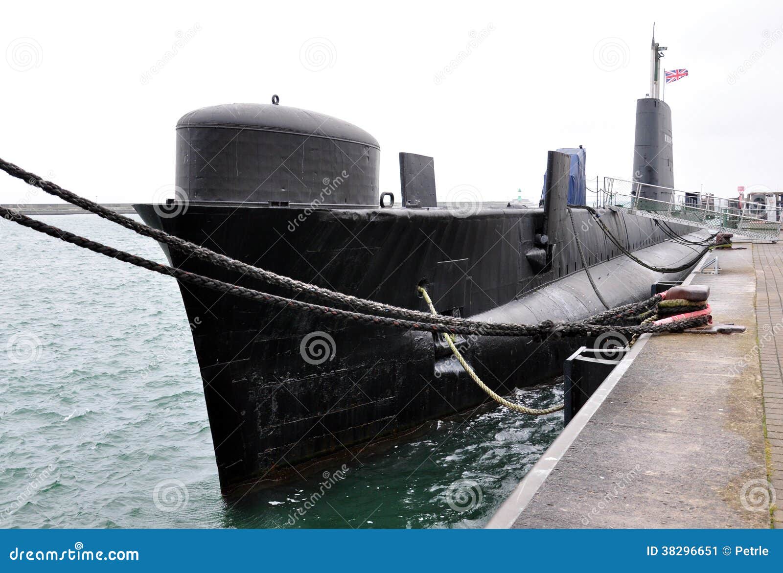 Submarine in a dock at sea stock image. Image of iron - 38296651