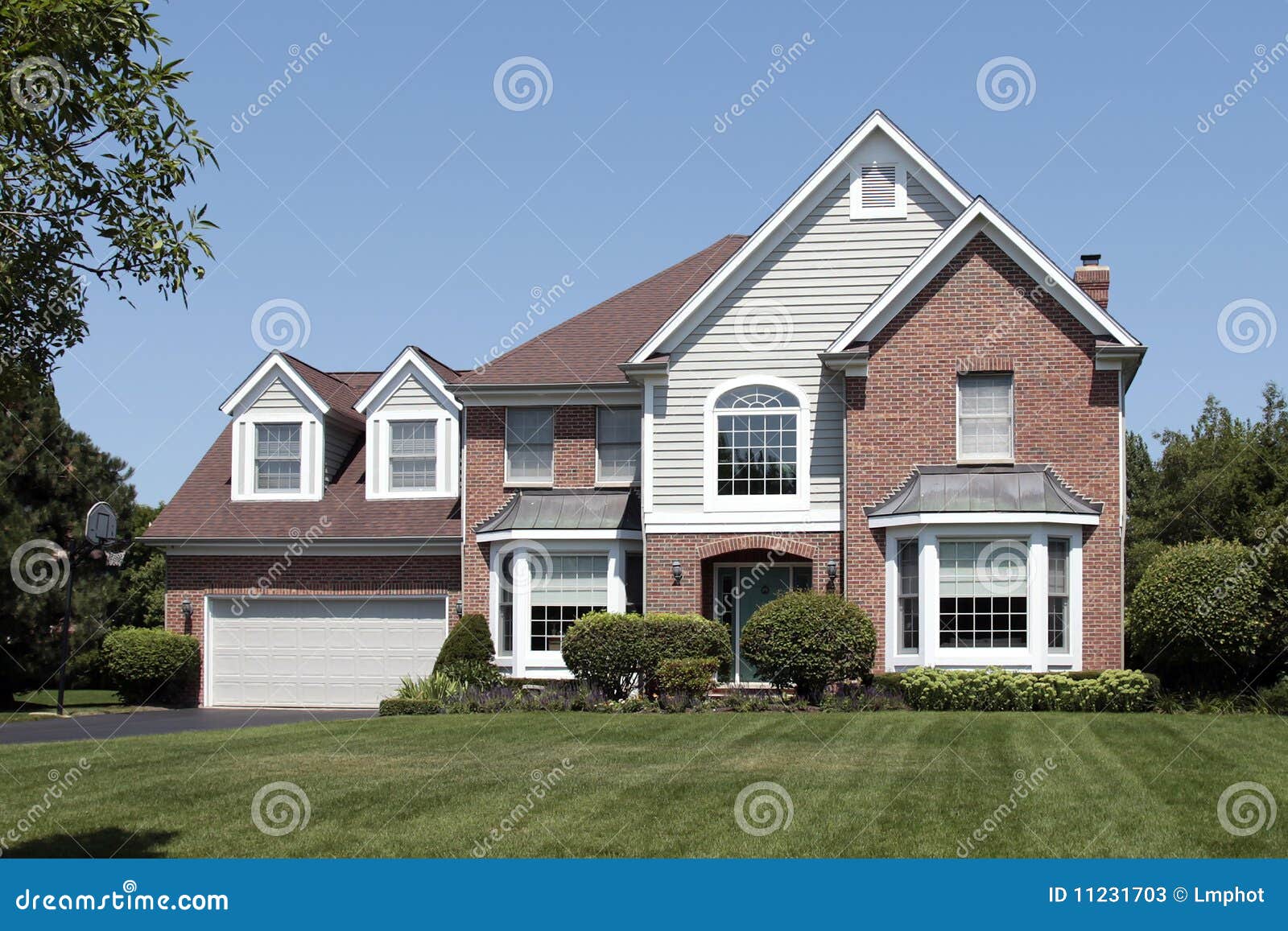Suburban Home with Arched Entry Stock Image - Image of luxury, living ...