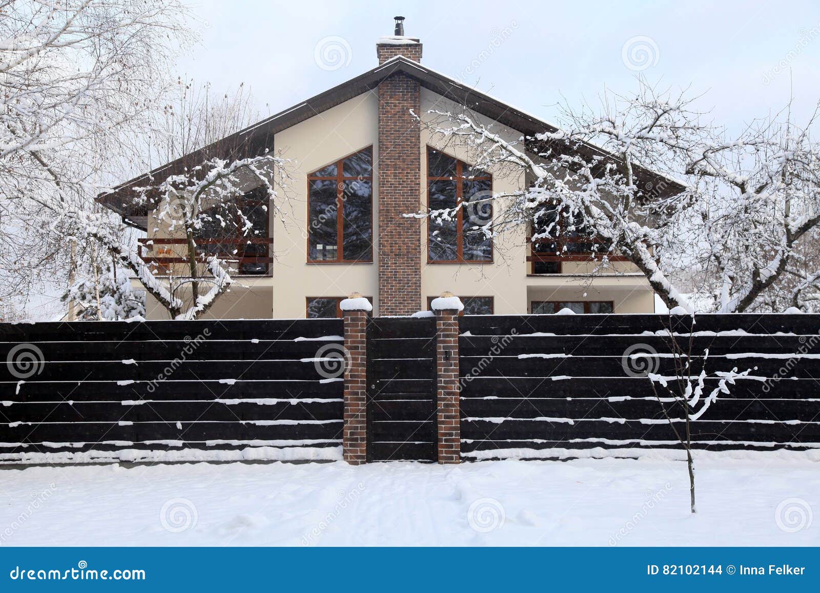 Suburban Home Under Snow in Winter Stock Photo - Image of brick ...