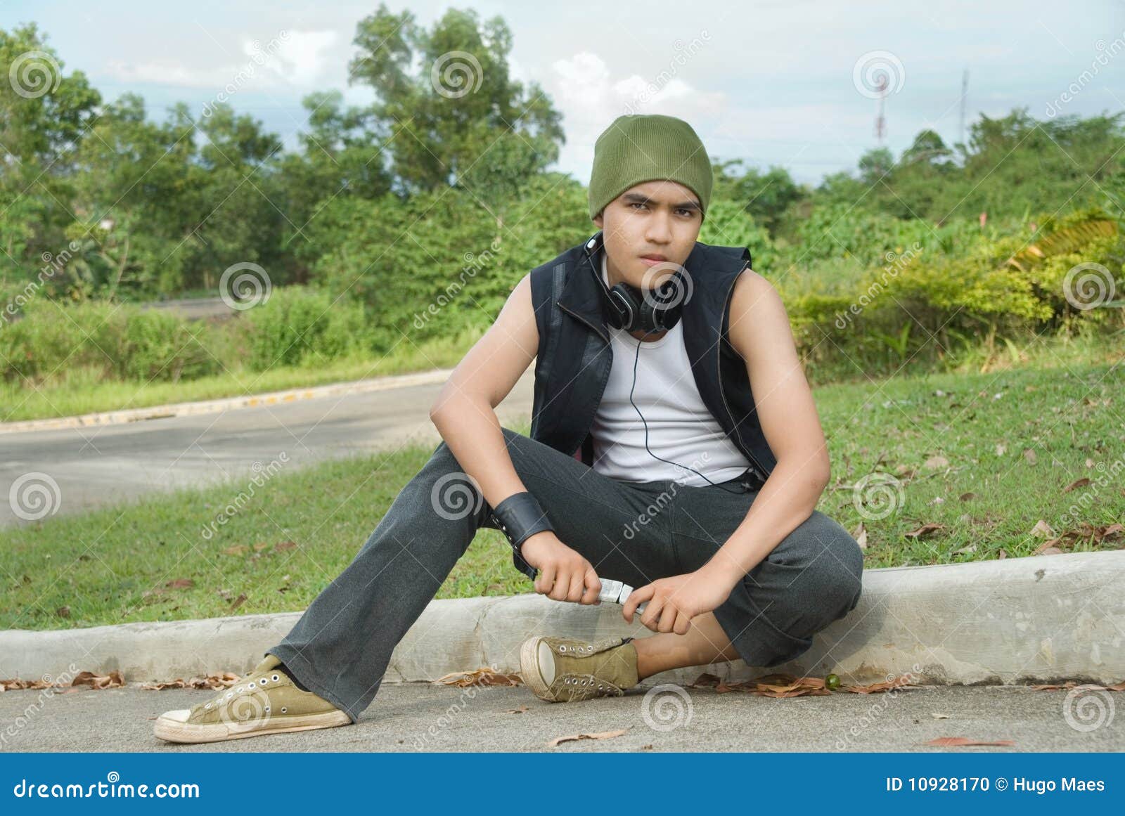 Suburban Rapper Sitting on Street Stock Photo - Image of pose, gangsta ...