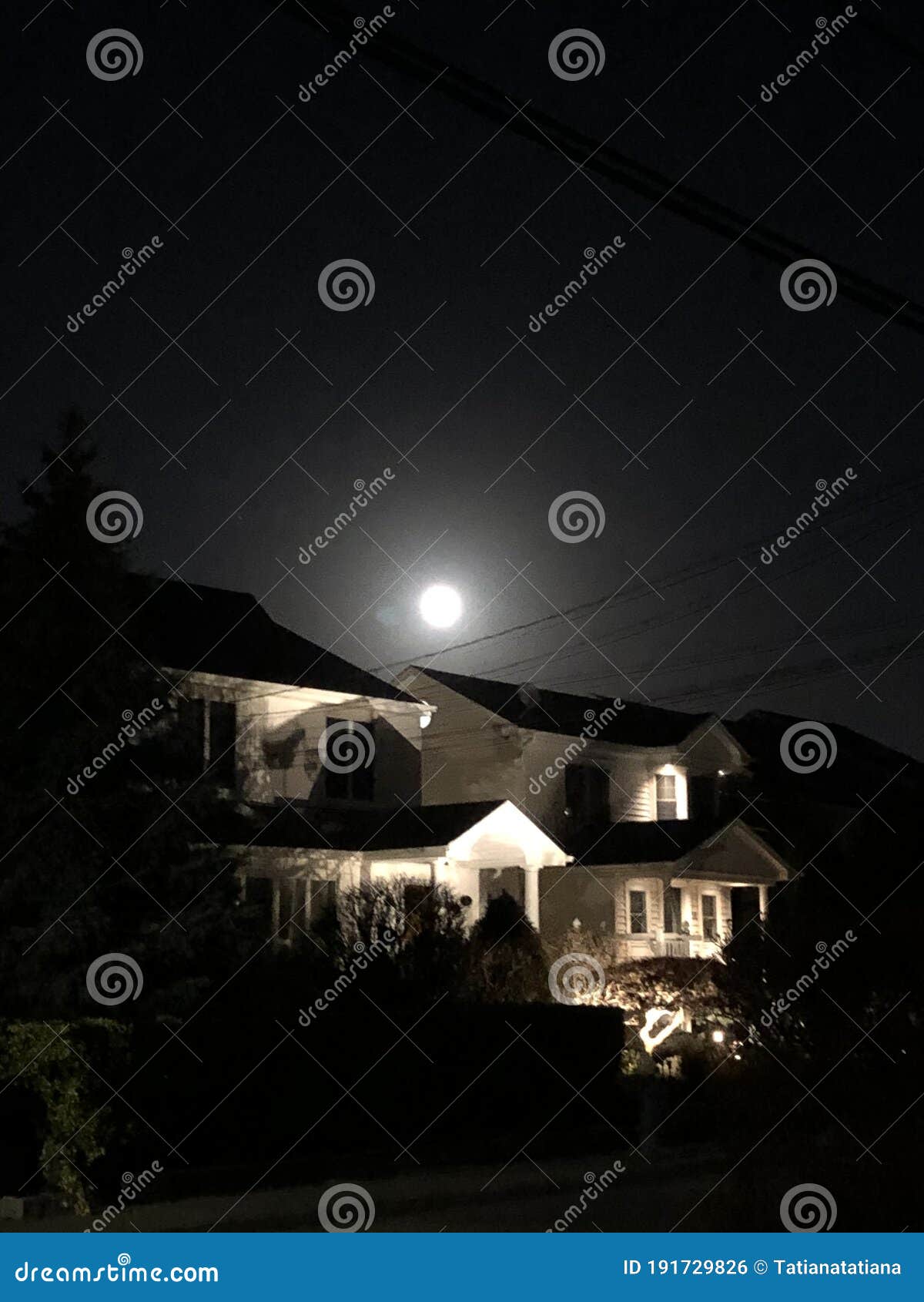 The moon over houses stock photo. Image of architecture - 191729826