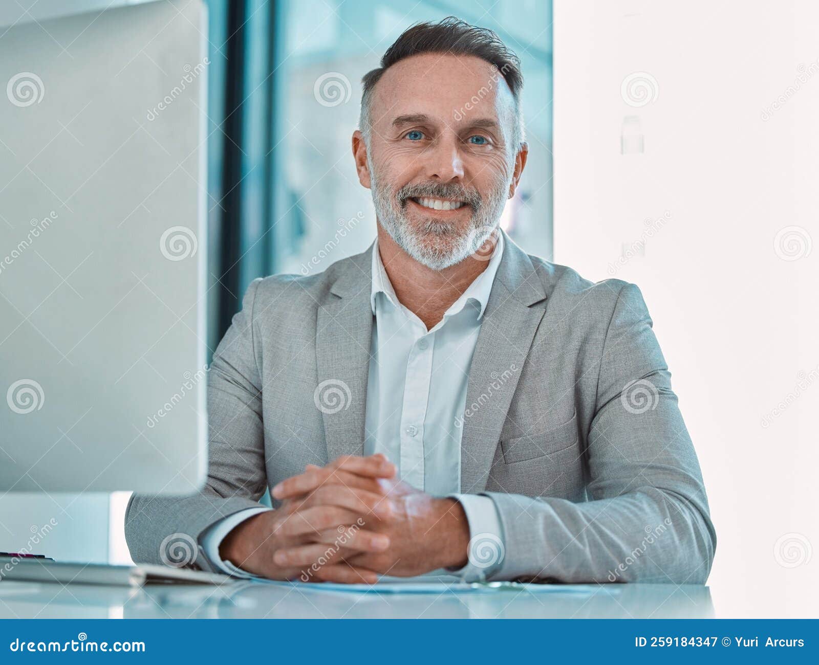 Success is Best when Its Shared. a Mature Businessman Sitting at a Desk ...
