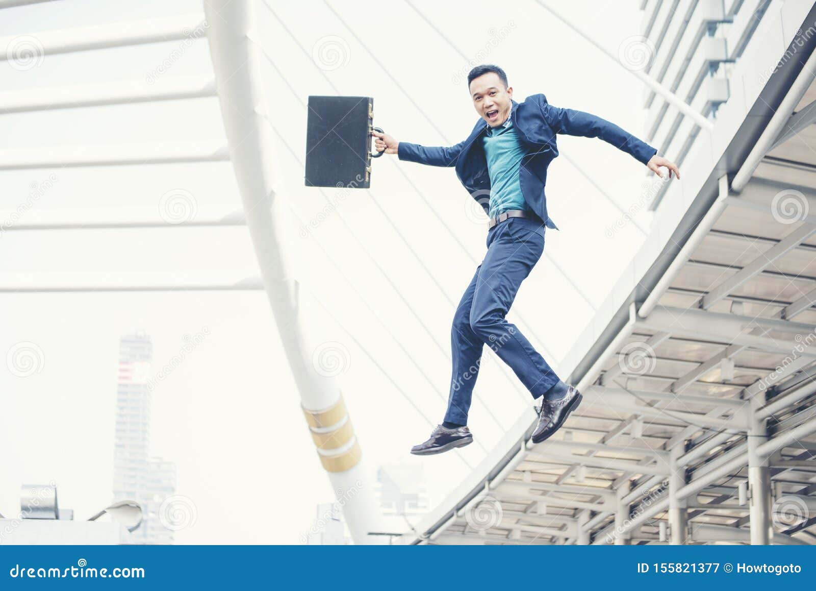 Success Business Man Jumping Smiling in the Air with Confident. Stock ...