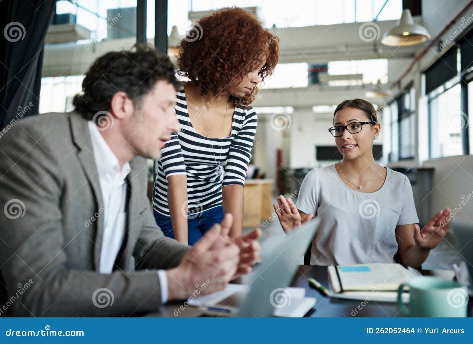 Success is Earned. Office Workers Talking in a Meeting in an Office ...