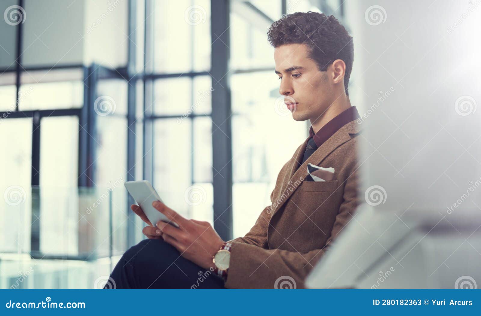 Success is a Given Using the Right Tools. a Young Businessman Using a ...