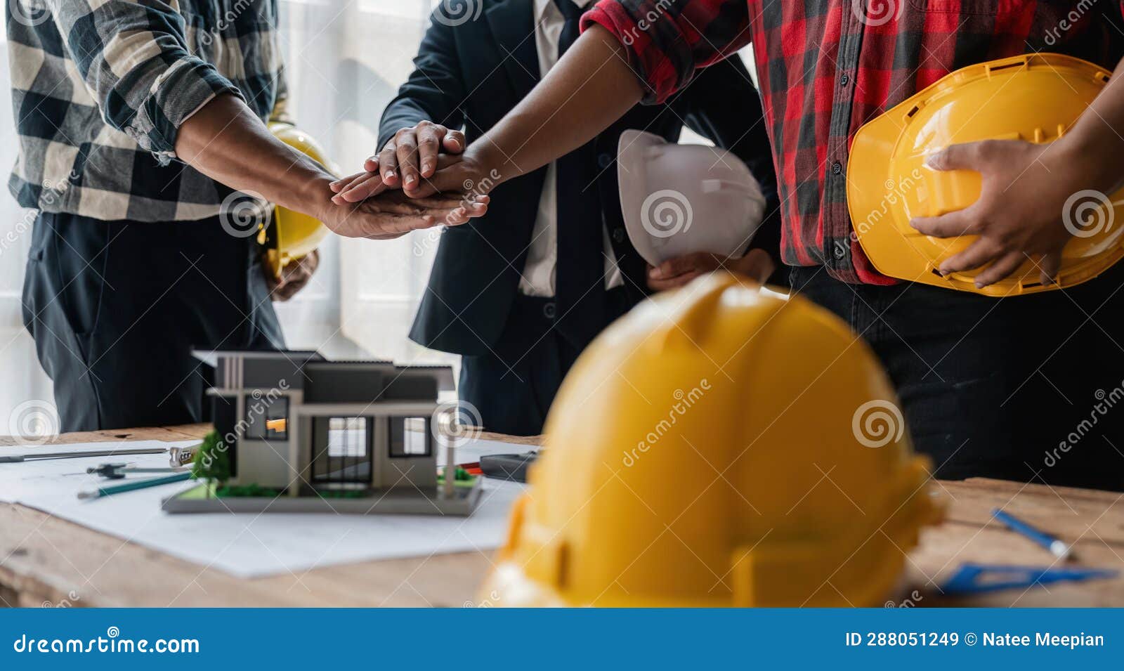 Group Of Engineer Checking The Blueprint On The Table And Talking About ...