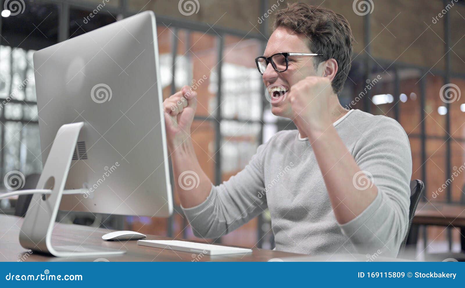 Success Guy Celebrating while Working on Computer Stock Image - Image ...