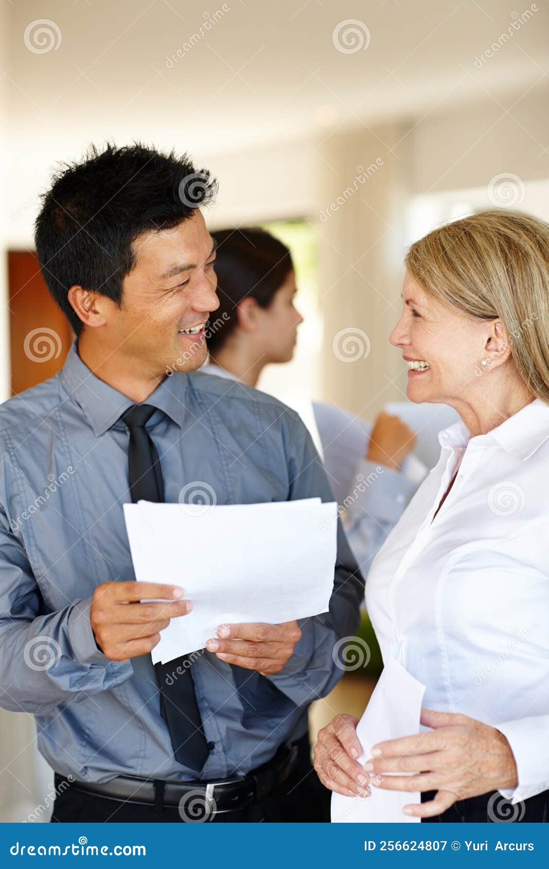 Success Shared through Diversity. Two Business Professionals Conversing ...