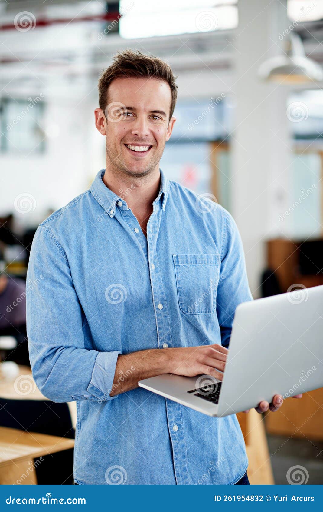 Success is Trending Right Now. a Man Working on a Laptop in an Office ...