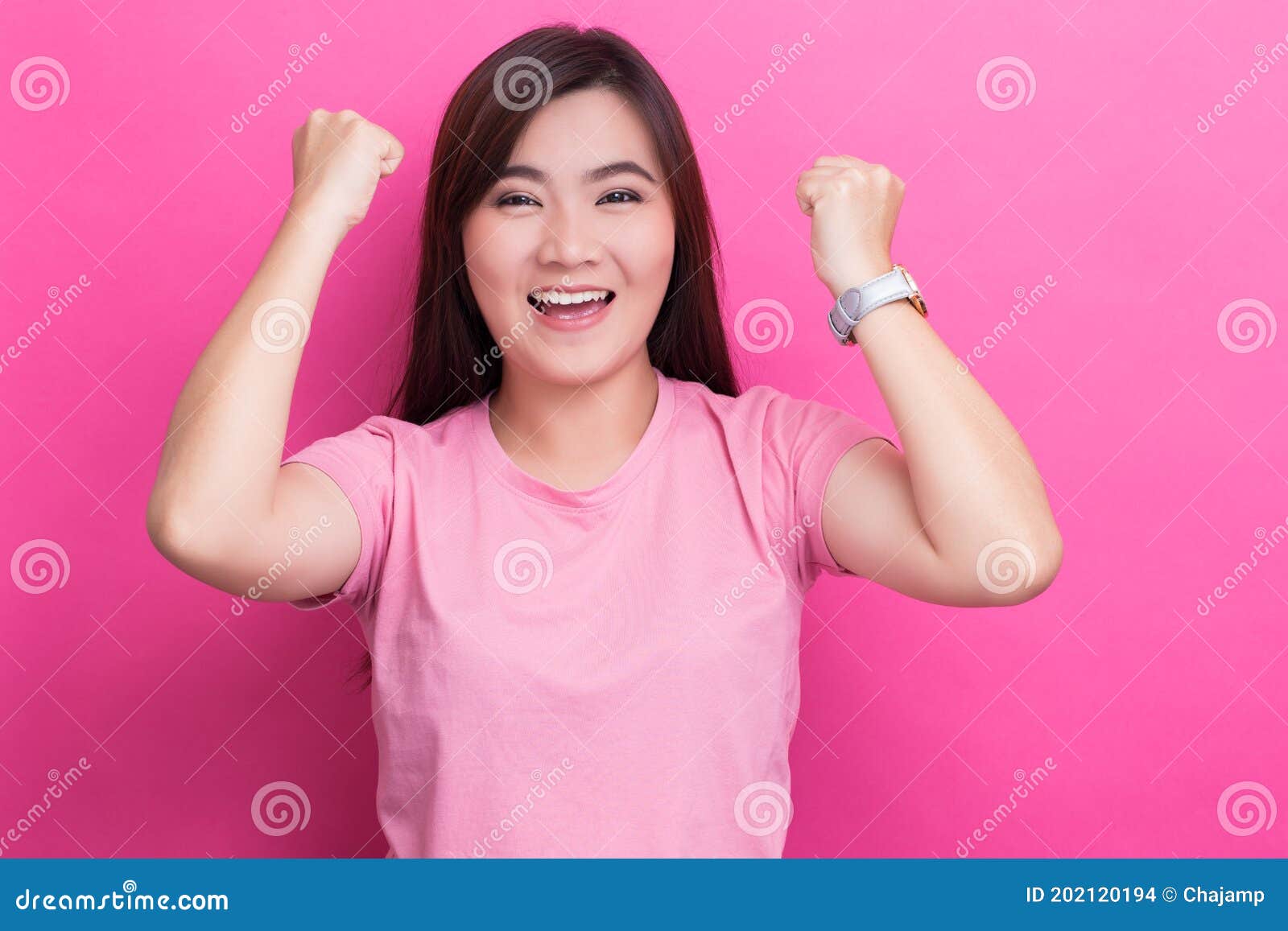 Success Woman Happy Being a Winner Over Pink Background Stock Photo ...