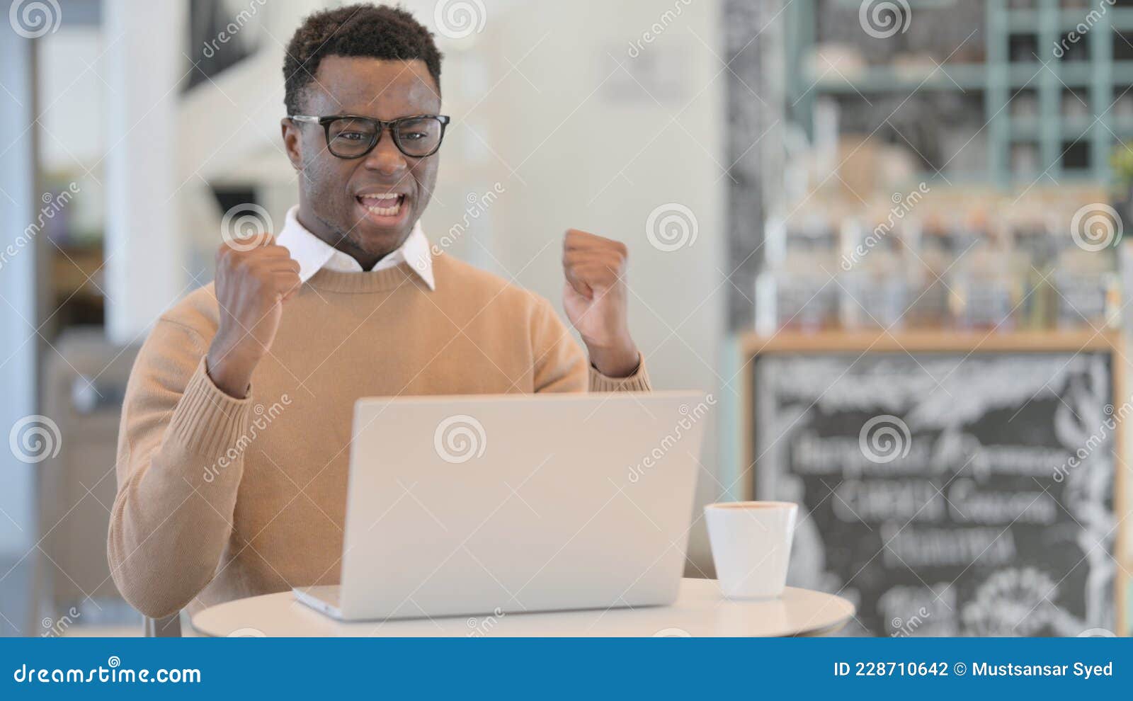 Successful African Man Celebrating on Laptop Stock Photo - Image of ...