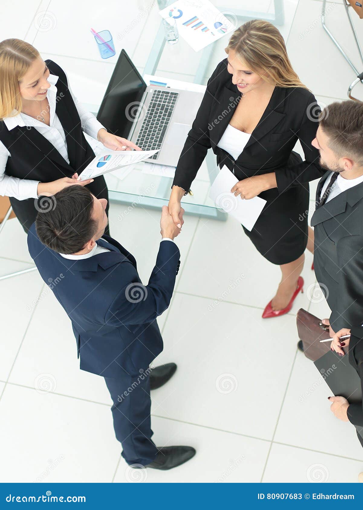 Successful Busines Team Making Handshake in an Modern Office Stock ...